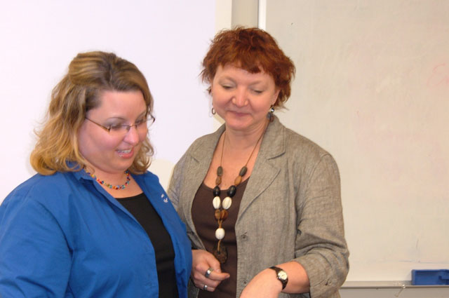 Kelly discussing technology resources with a fellow teacher in the USA.